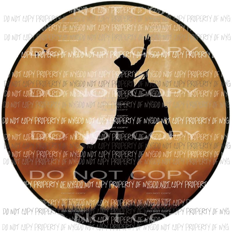 martodesigns - Cowboy riding a bull sunset background